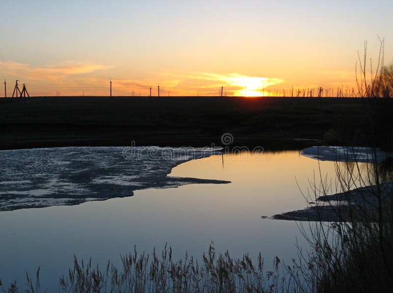 Sunset over the flatland stock photo. Image of evening - 234273152