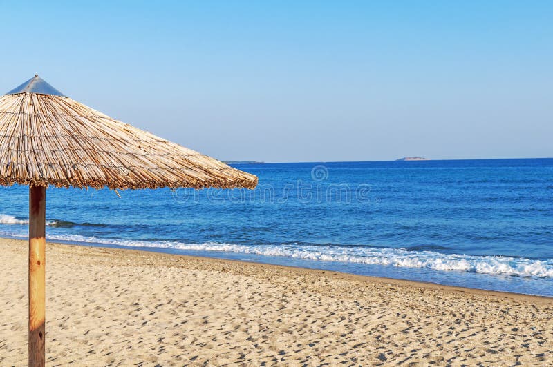 Reed Umbrella on the Beach To the Seaside Stock Image - Image of black ...