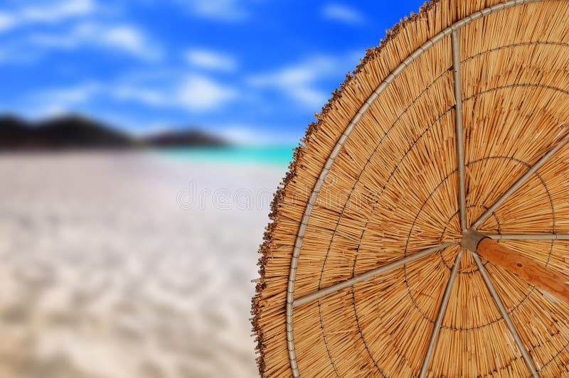 Reed Umbrellas Beach on the Blurred Beach Stock Image - Image of chair ...