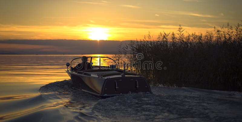 Reeds and motor boat stock photo. Image of blue, outdoors - 45923946