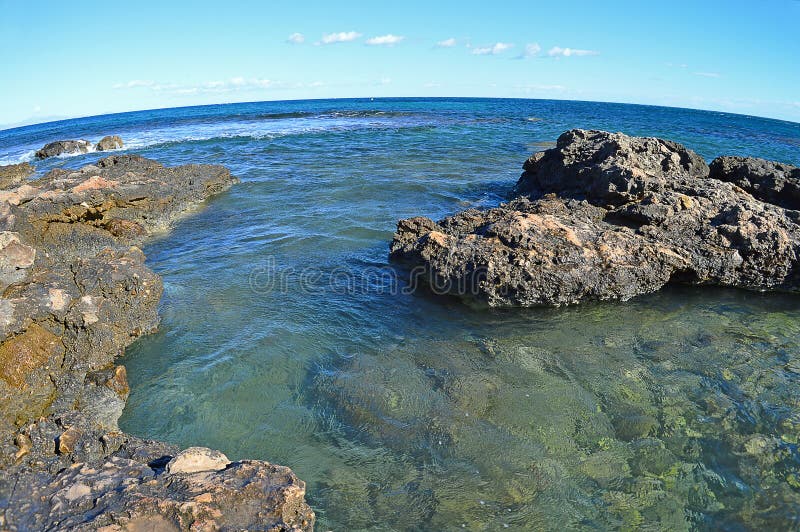 A Rocky Reef in the Sea with a Dramatic Sky Stock Image - Image of ...