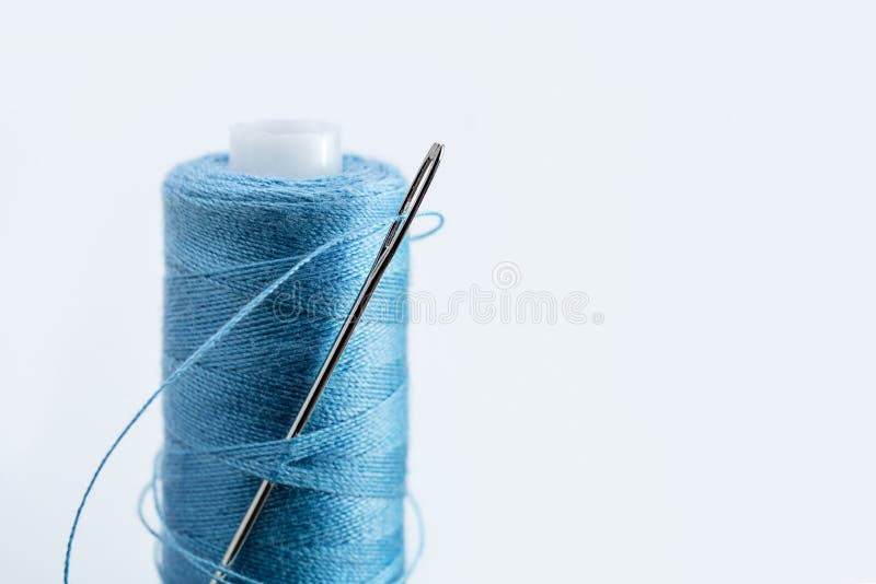 In Coil of Blue Thread Large Needle for Sewing. Stock Photo - Image of ...