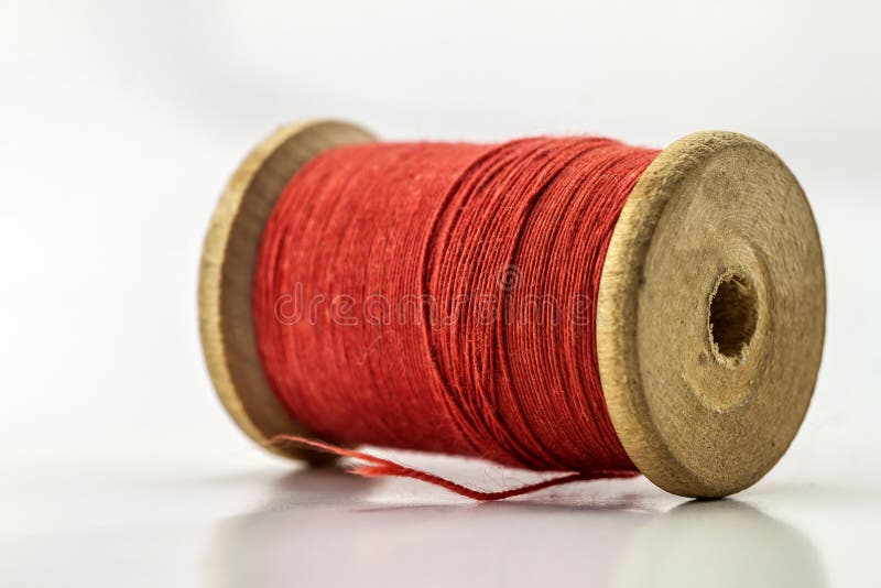 Reel or Spool of Red Sewing Thread Isolated on White. Shallow De Stock ...