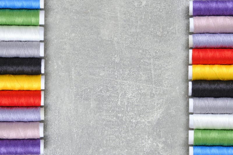 Reels with Multi Colored Sewing Threads Gray Concrete Background. Stock ...