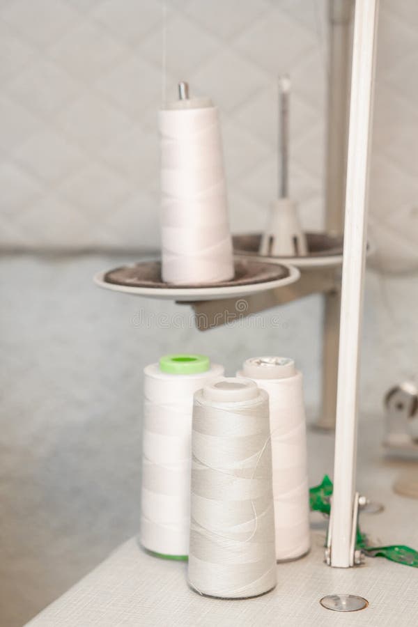 Reels with White Threads for a Sewing Machine on a Stand in Atelier ...