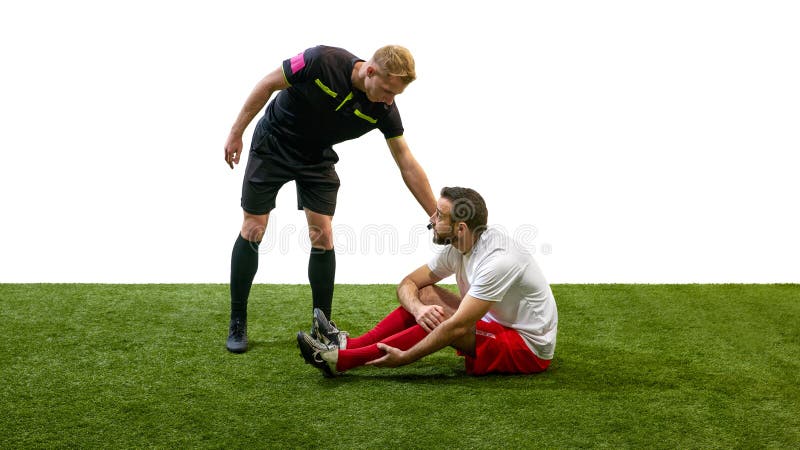Referee Calling for Help, Standing Next To Man Sitting on Floor with ...