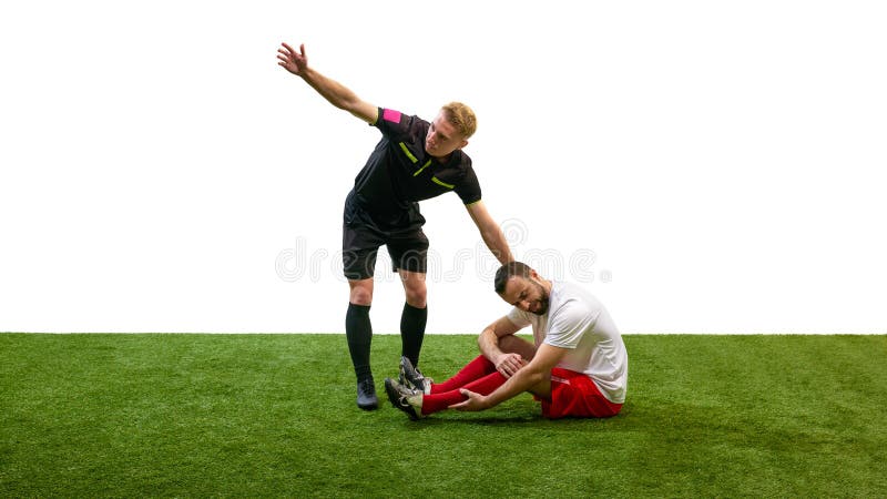 Referee Calling for Help, Standing Next To Man Sitting on Floor with ...