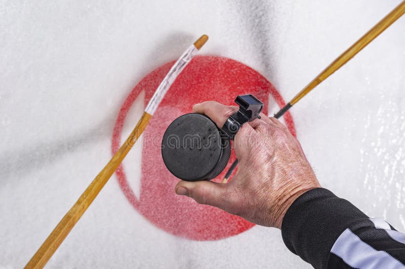 Referee Dropping Ice Hockey Puck in the Faceoff Circle Stock Image ...