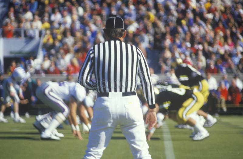 Referee at a football game editorial stock image. Image of stripes ...