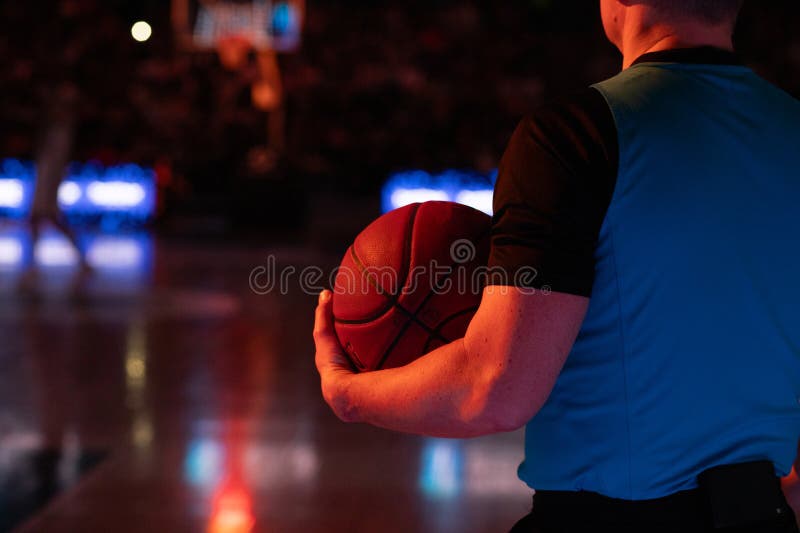 Referee Holding Basketball during Game Stock Photo - Image of basket ...