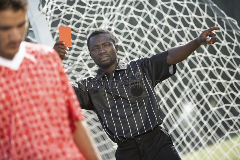 Referee Holding Out Red Card Stock Image - Image of young, sport: 13585093