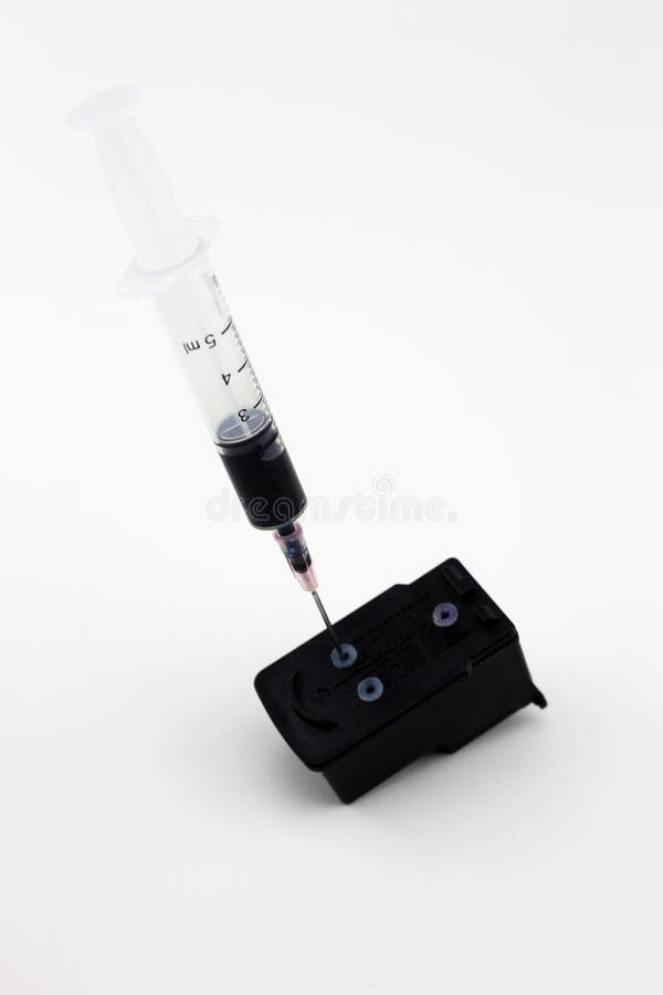 Refilling ink cartridges stock photo. Image of plastic - 65420336
