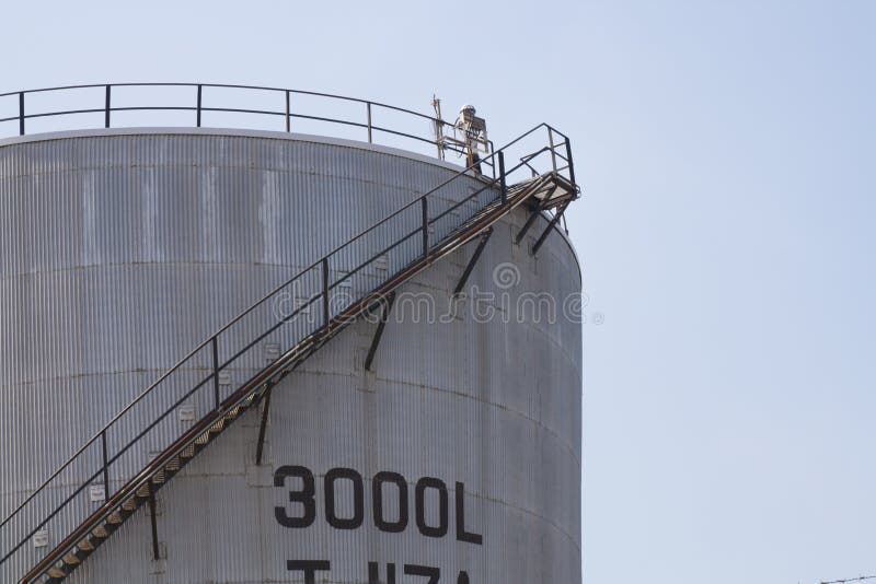 Worker and oil towers stock image. Image of gasoline - 20560713
