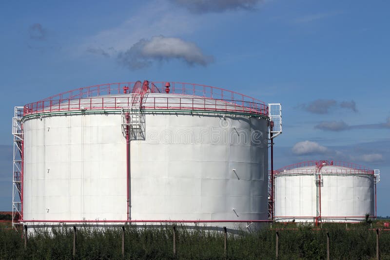 Refinery oil tanks stock photo. Image of industry, cloud - 41404020