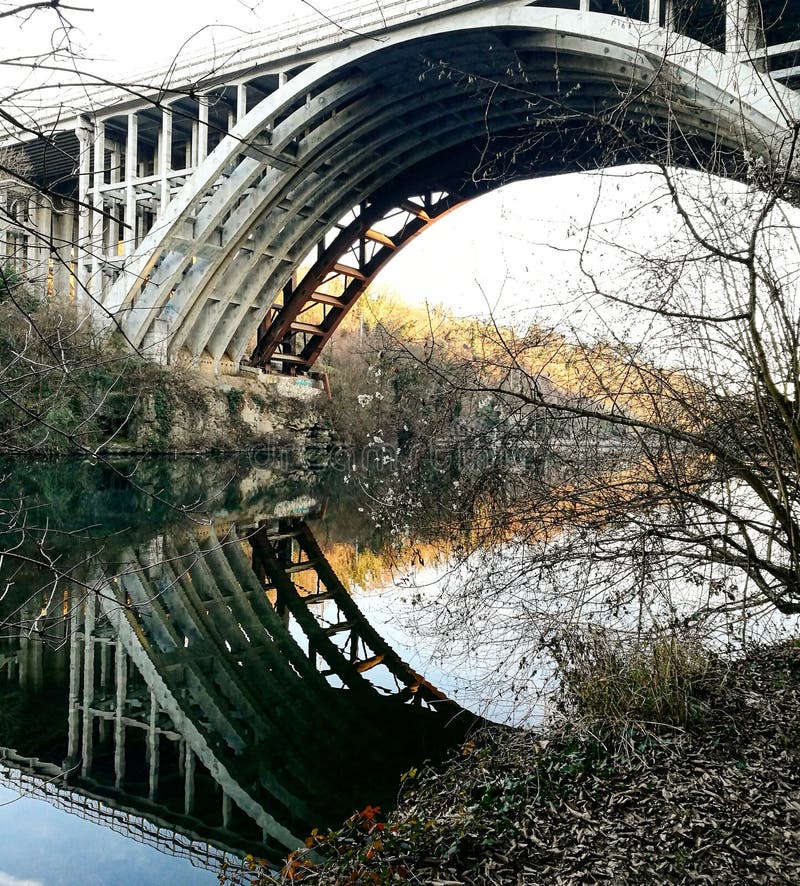Reflected bridge at dusk stock image. Image of recreation - 33238747