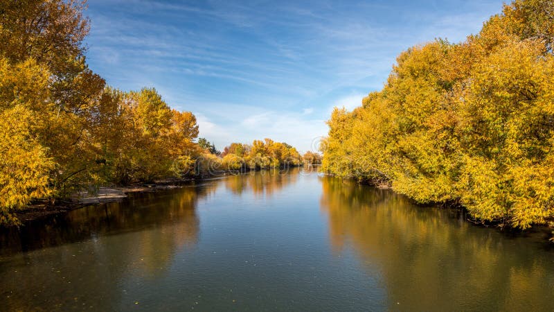 Fall Trees Line a River in Boise Idaho with Blue Sky Stock Image ...