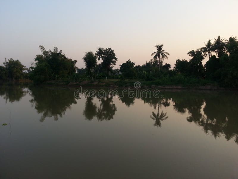 The Reflection on the Banks of the Tha Chin River Stock Image - Image ...
