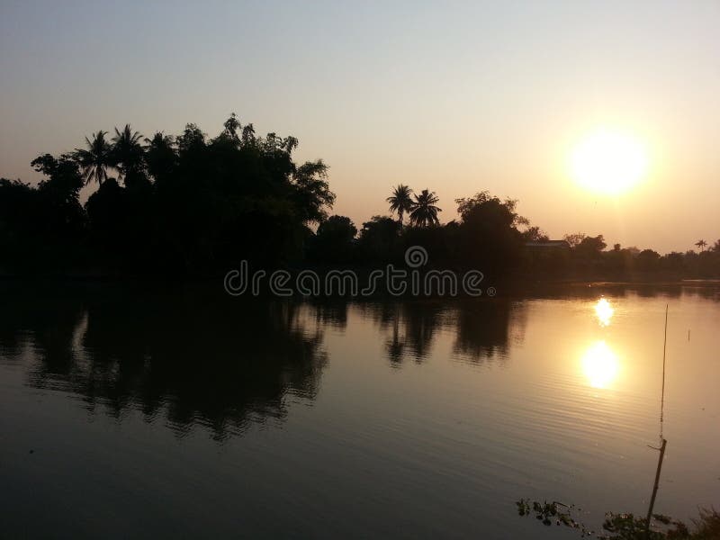The Reflection on the Banks of the Tha Chin River Stock Image - Image ...