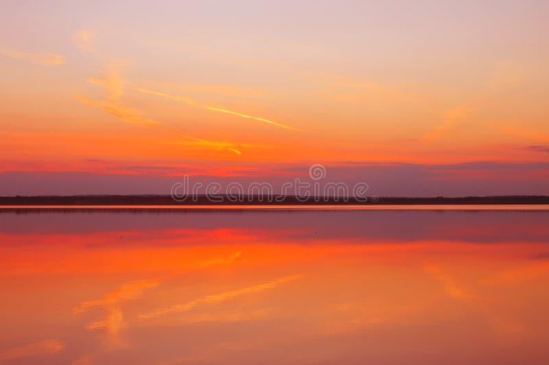 Reflection of a Beautiful Sunset Over the Water Stock Image - Image of ...