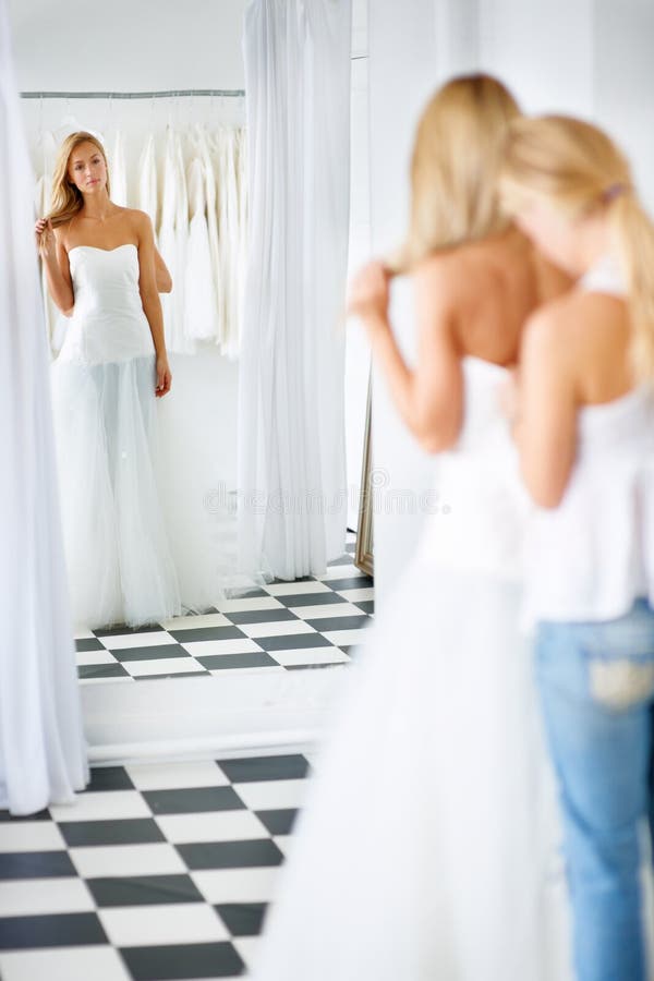 The Reflection of Beauty. a Young Bride Looking at Her Reflection in a ...