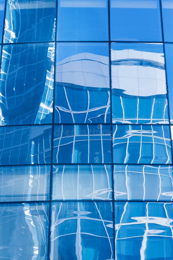 Reflection in Blue Glass Wall of an Modern Office Building Stock Photo ...