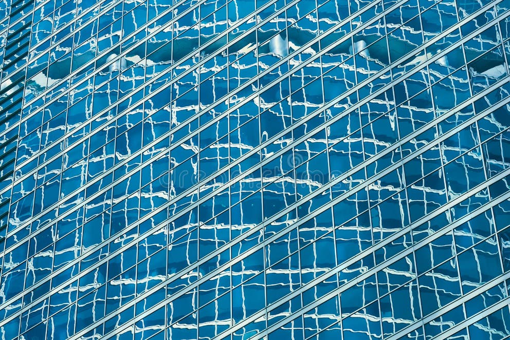 Reflection in Blue Glass Wall of Modern Office Building Stock Image ...