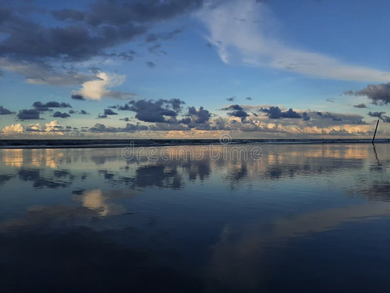 The Reflection of the Blue Sky Above the Sea Stock Photo - Image of ...