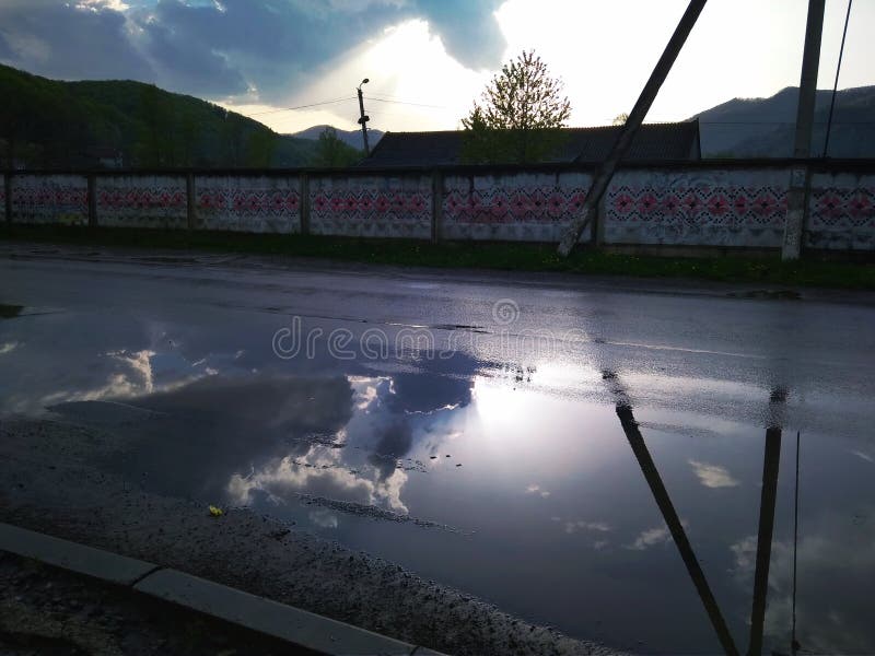 Reflection of Blue Sky after Rain with Beautiful Dark and Light Clouds ...