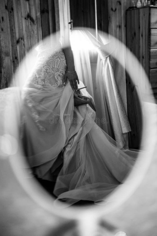 Reflection of the Bride`s Shoes in the Mirror. Black and White Photo ...