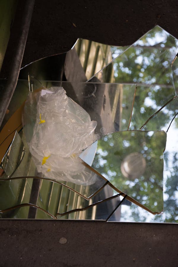 Reflection of a Broken Mirror on the Street Stock Photo - Image of ...