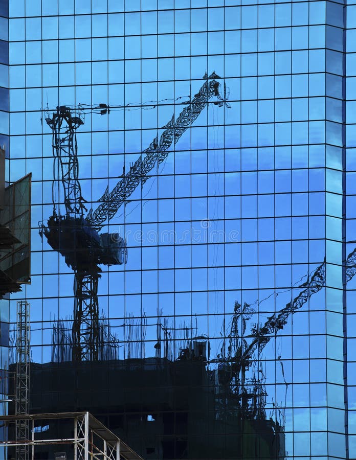 Reflection of Building Construction on Building Mirror Stock Image ...