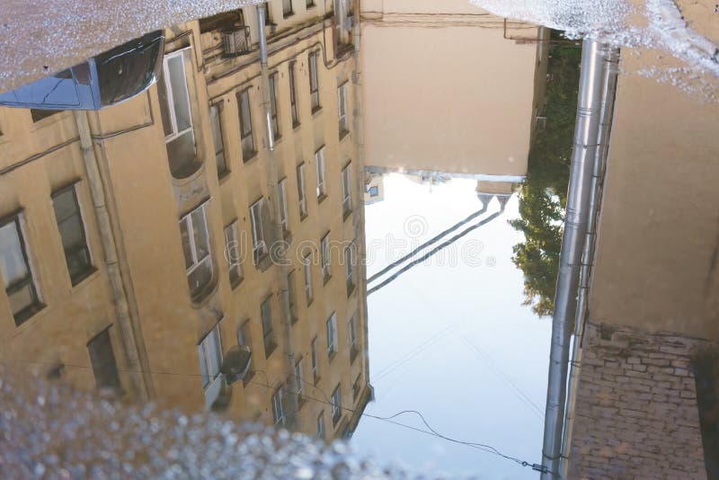 Reflection of a Building in a Puddle Stock Image - Image of dark, green ...