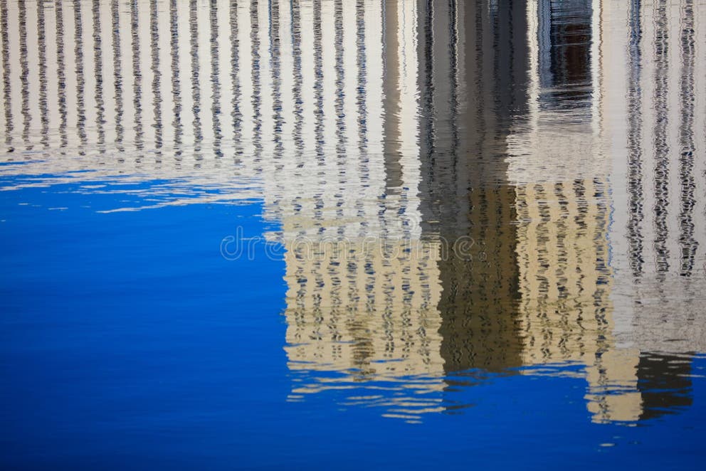 Reflection of a Building on the Surface of Water Stock Image - Image of ...