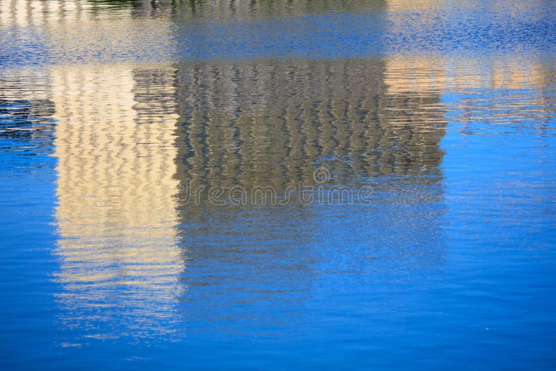 Reflection of a Building on the Surface of Water Stock Photo - Image of ...