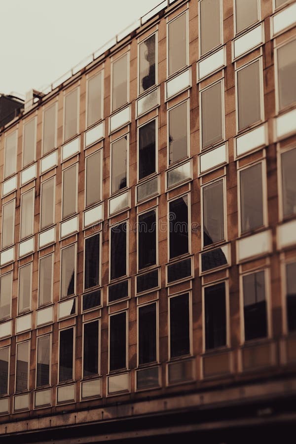 Reflection of a Building in the Windows of Another Building in an Urban ...