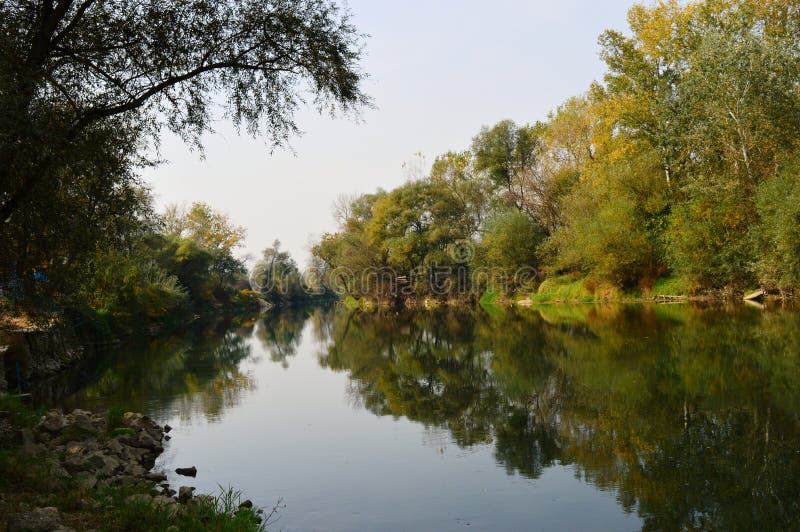 Reflection in the river stock photo. Image of color - 129670908