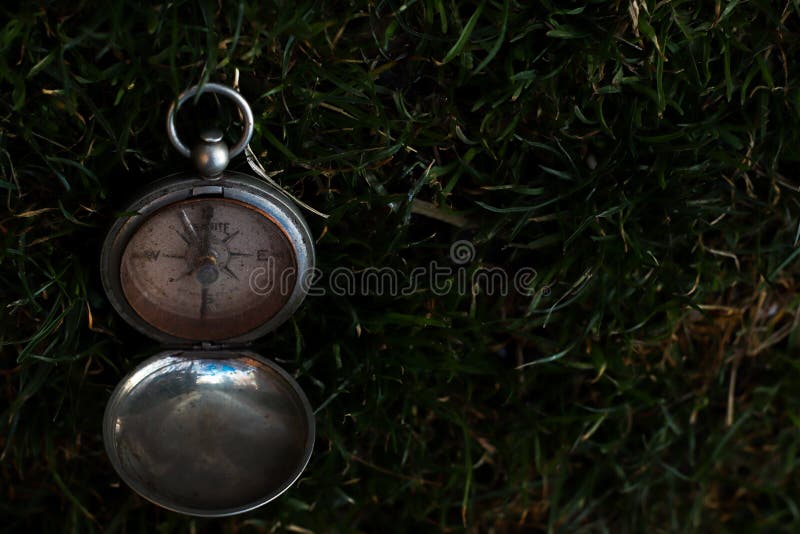 A compass points the way. stock image. Image of reflection - 215011753