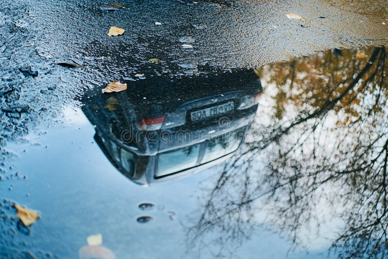 Reflection of a Car in a Puddle after Rain Stock Illustration ...