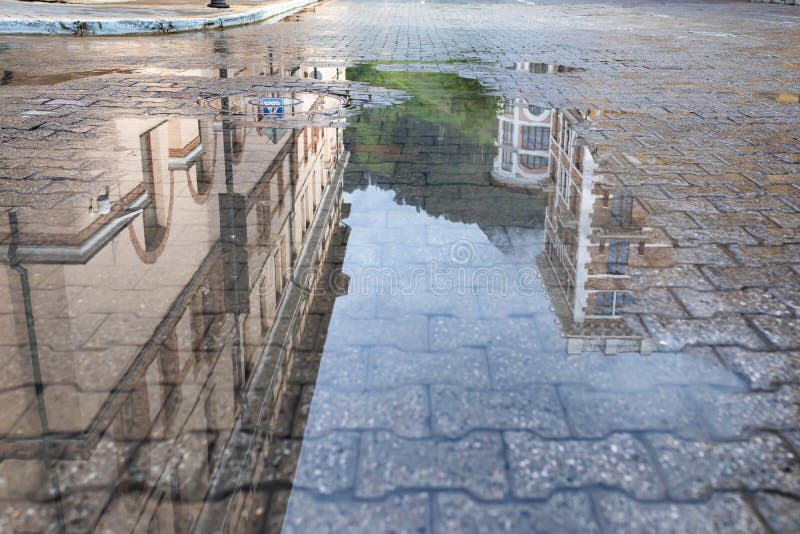 Reflection of City Buildings in Puddles after Rain Stock Image - Image ...