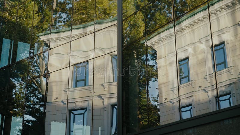 Reflection of Classic Building in Modern Glass Facade Stock Footage ...