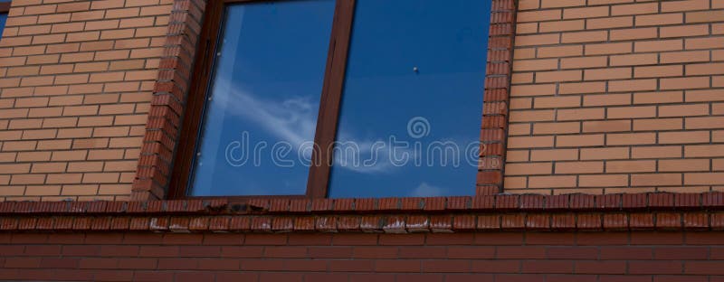 Reflection of Clouds and Blue Sky in the Window of the House Stock ...