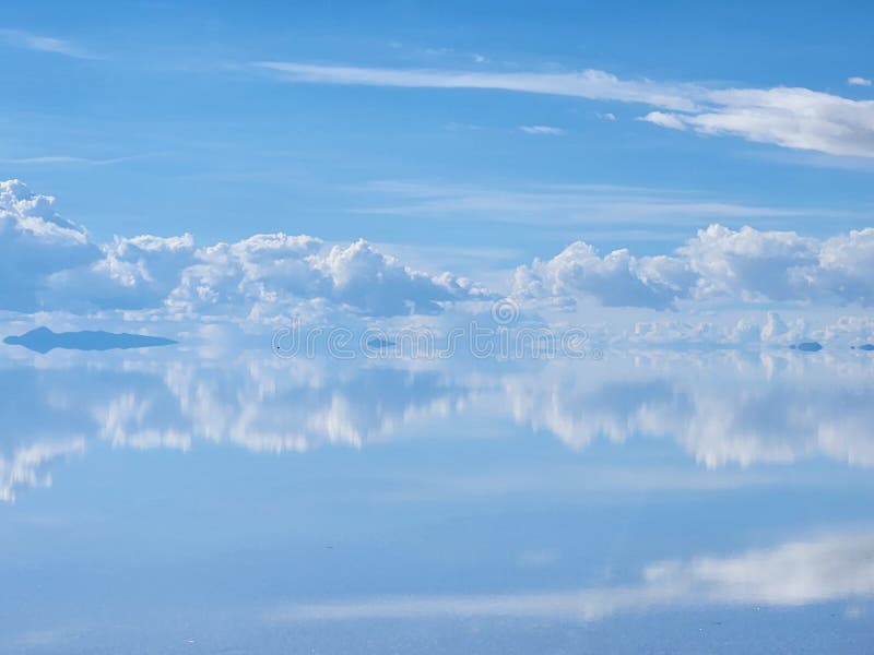Reflection of the Clouds in Salar De Uyuni Salt Lake, Bolivia Stock ...