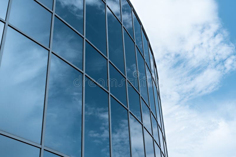 Reflection of Cloudy Sky in a Modern Building with Large Mirrors Stock ...