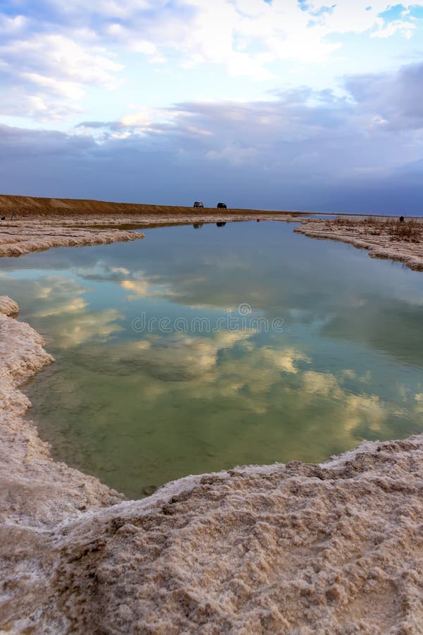 Silhouettes on salt lake stock image. Image of saline - 1307505