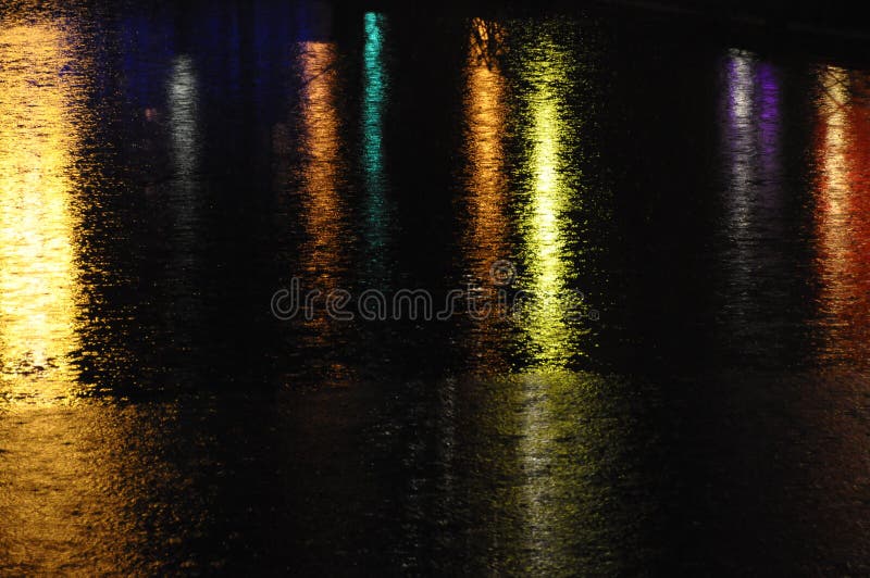 Reflection of Colored Lights on Water Stock Photo - Image of dark ...