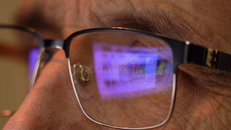 Reflection of the Computer Screen in Glasses. Elderly Man S Eyes with ...