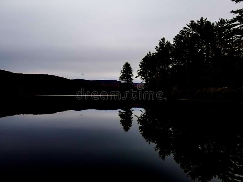 A Reflection of the Day Off the Water Stock Photo - Image of water ...