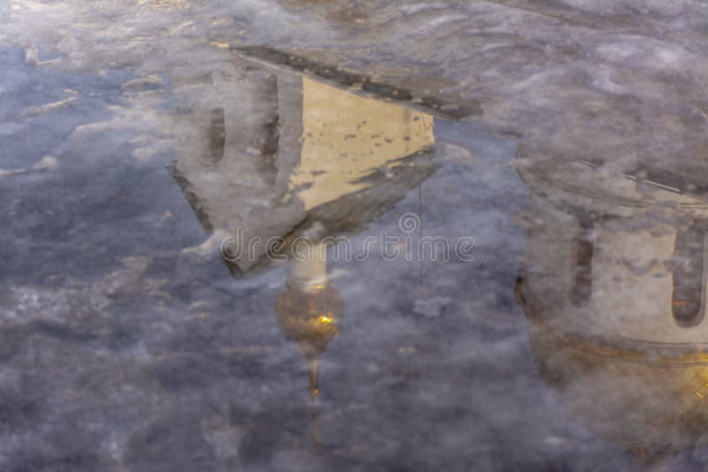 Reflection of the Dome of the Temple in the Frozen Melted Snow Stock ...