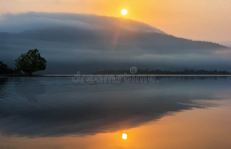 Reflection Early Morning on Dam. Stock Photo - Image of dawn, clouds ...