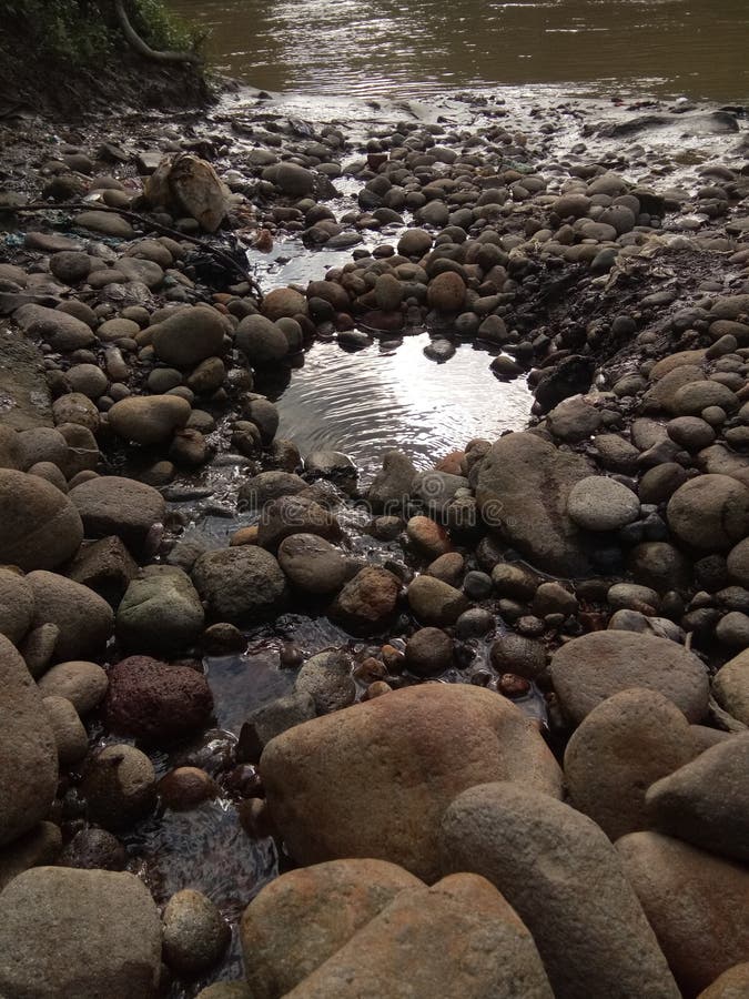 Reflection of the Evening Light between the River Rocks Stock Photo ...